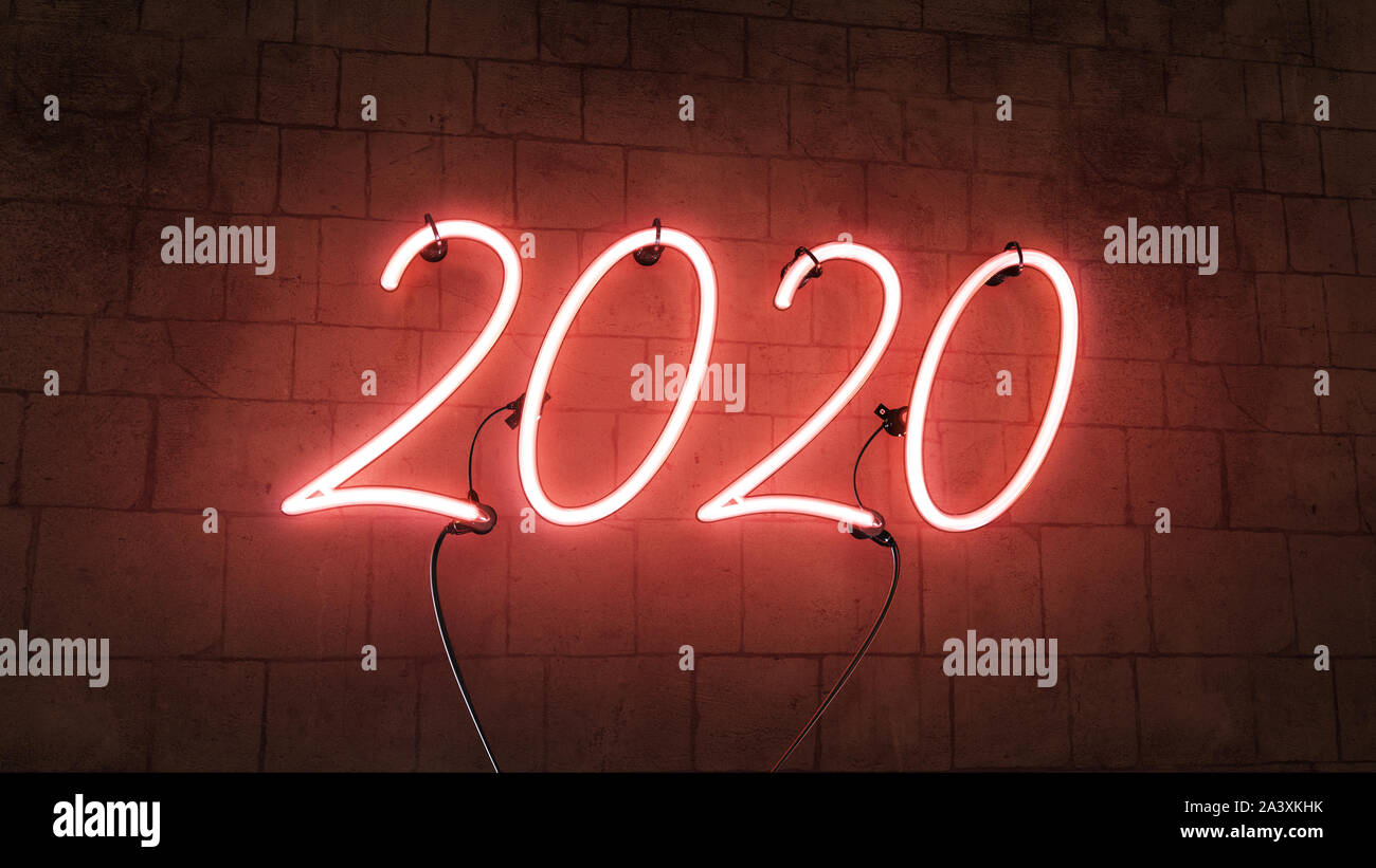 New Years Eve bright red neon sign saying the year 2020 Stock Photo - Alamy