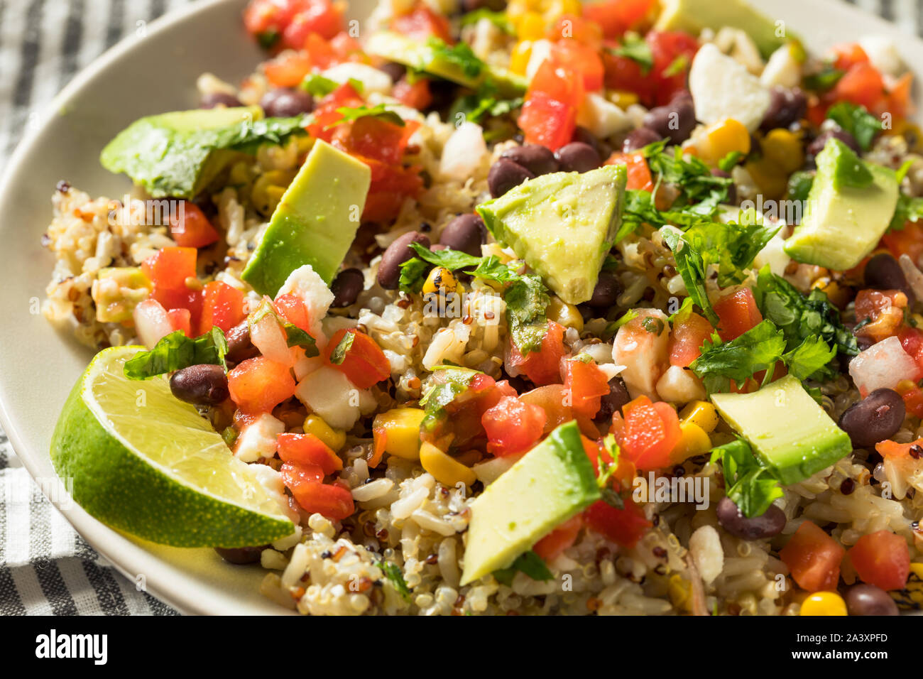 Homemade Mexican Baja Rice Bowl with Avocado and Salsa Stock Photo - Alamy