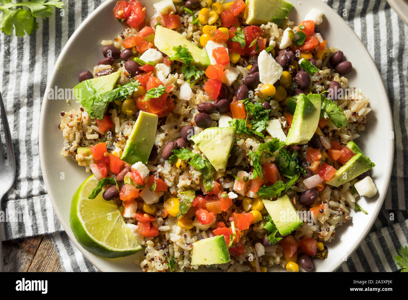 Homemade Mexican Baja Rice Bowl with Avocado and Salsa Stock Photo - Alamy