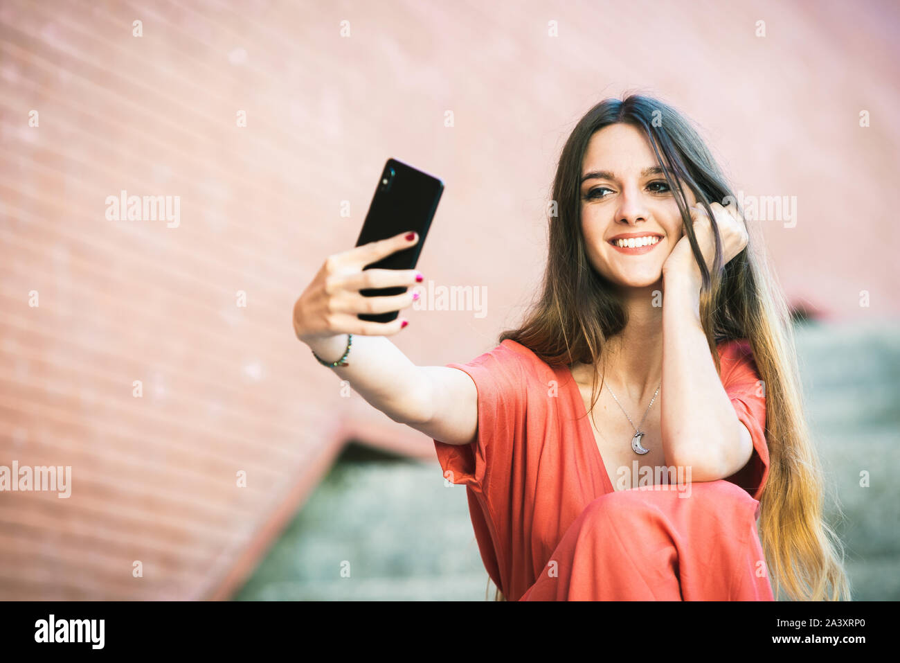 beautiful young woman takes a selfie on mobile phone Stock Photo - Alamy