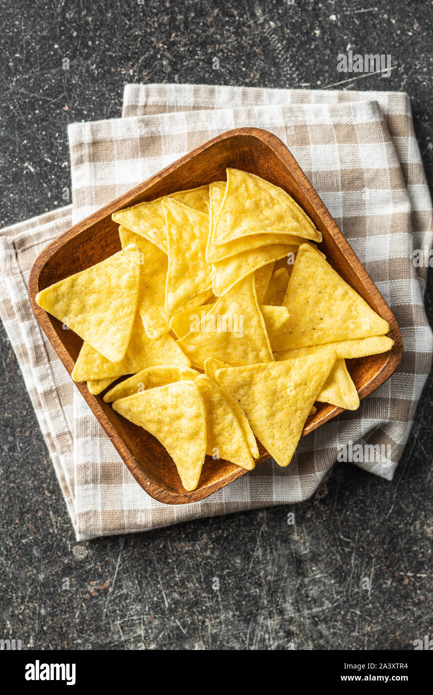 Corn nacho chips. Yellow tortilla chips in wooden bowl. Top view Stock ...