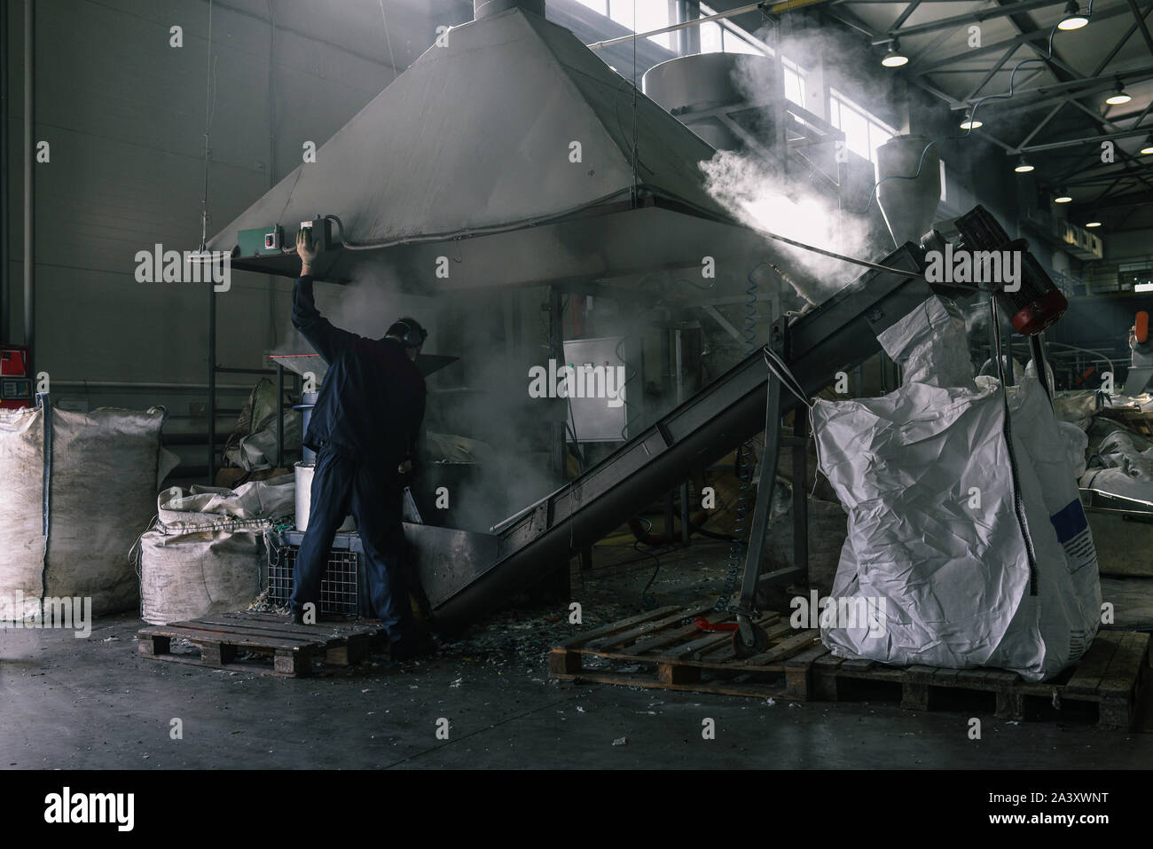 A man works in an industrial enterprise. The process of work in the ...