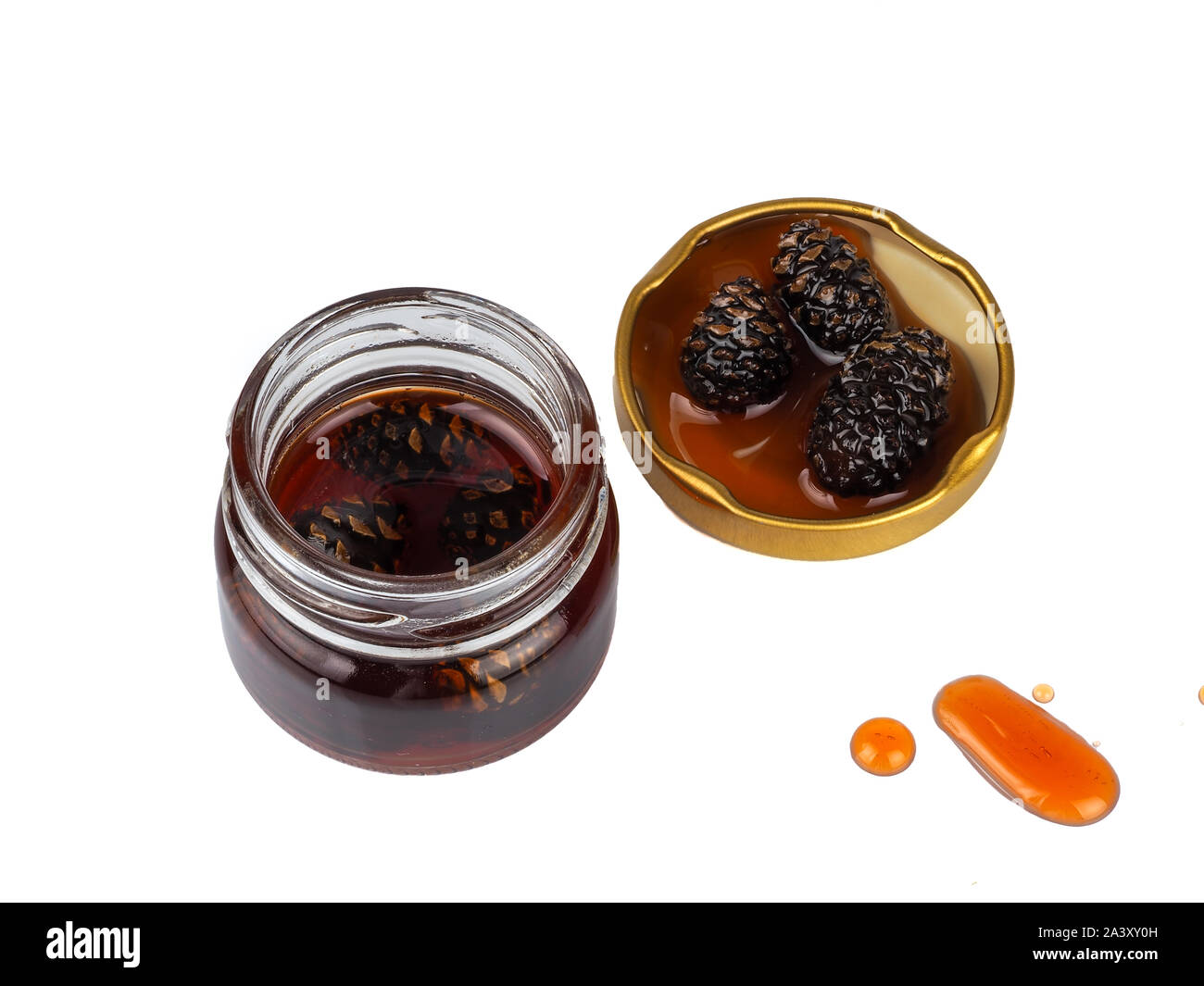 Young pine cones jam in a jar Stock Photo - Alamy