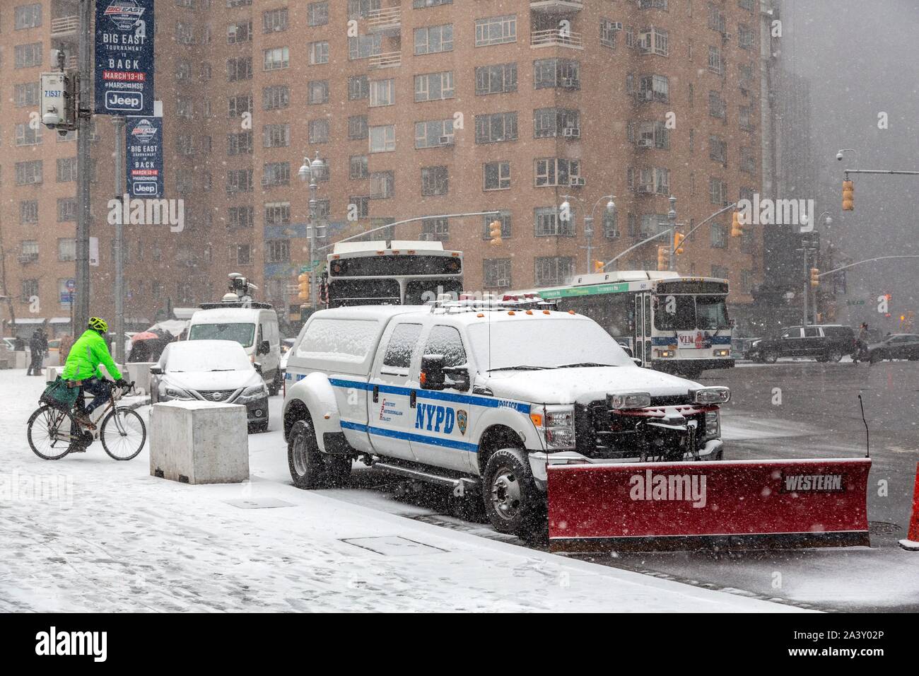 POLICE CAR EQUIPPED WITH A SNOW PLOW IN FRONT OF THE TRAFFIC CIRCLE AT ...