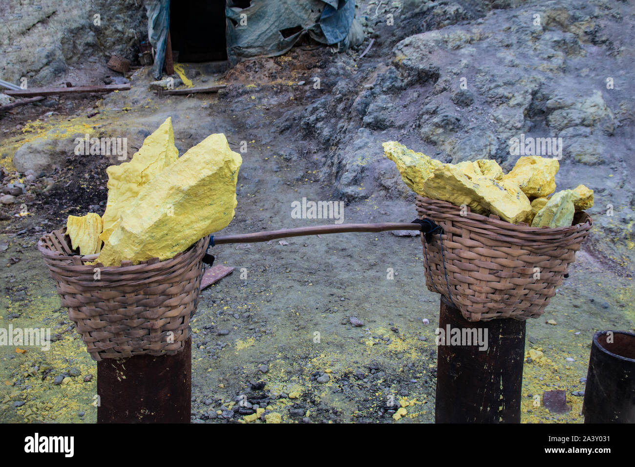 Baskets of sulfur ore mined from the crater of Mount Ijen, East Java ...
