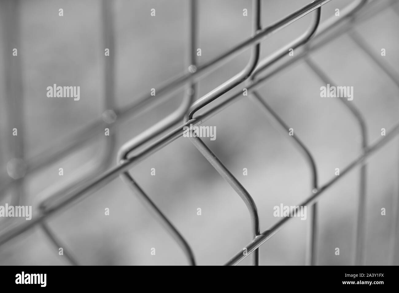 new grid fence close up, bw photo Stock Photo - Alamy