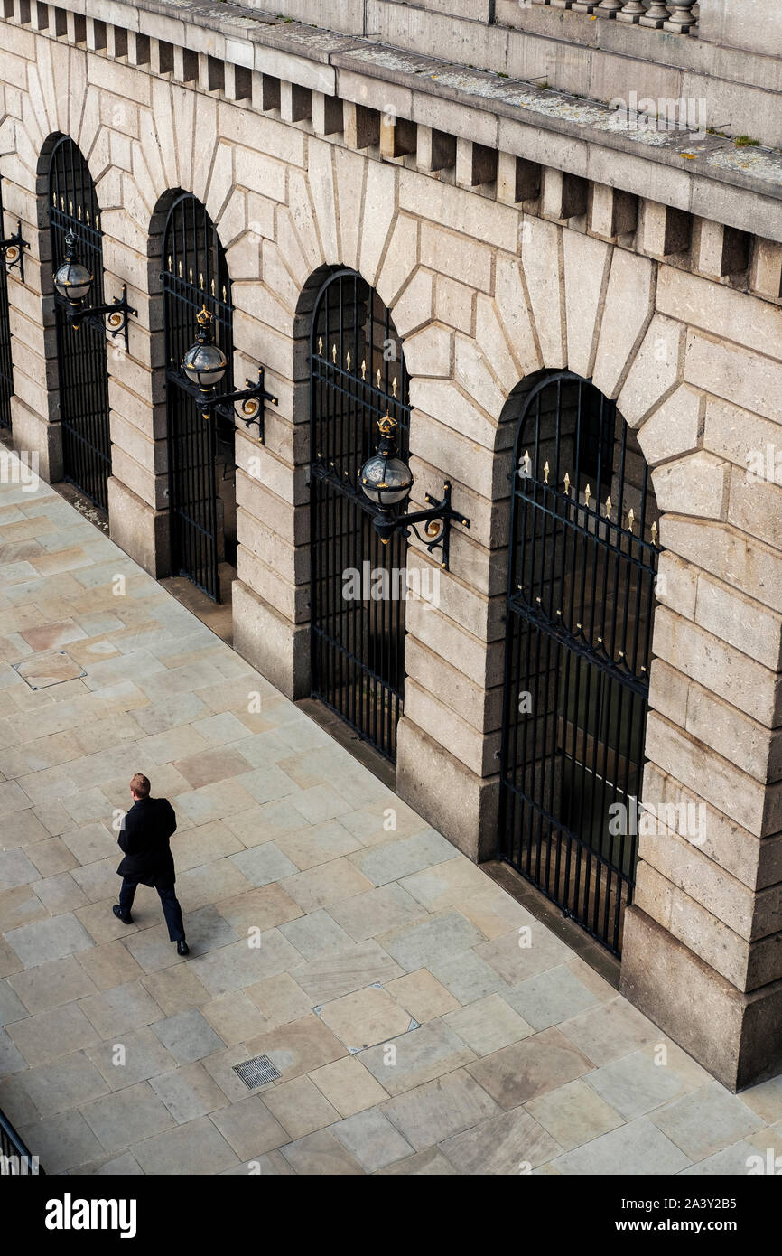 Man walking on the pavement, London, England Stock Photo - Alamy