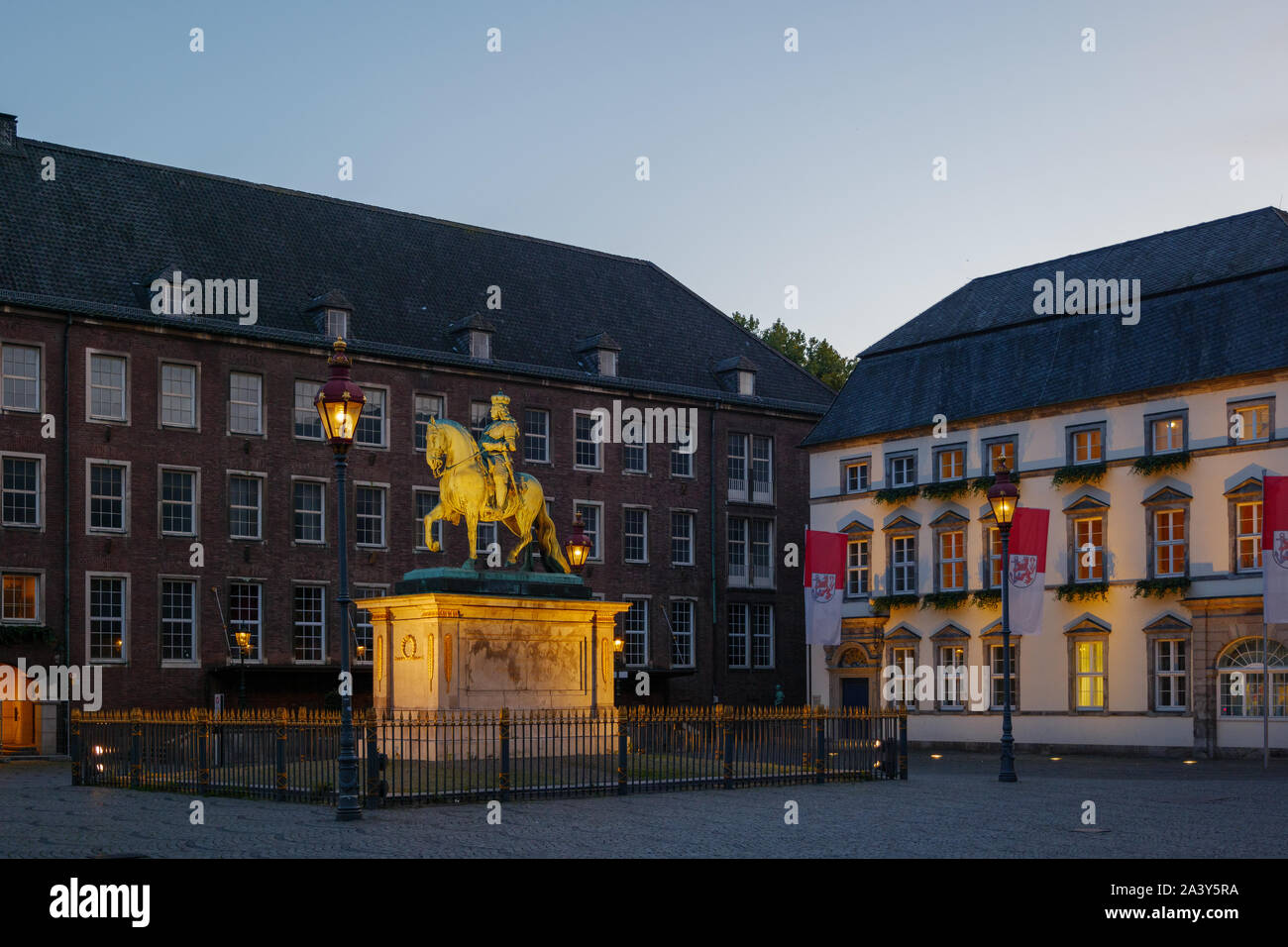 Night scenery of historical old town city center, market square, statue ...