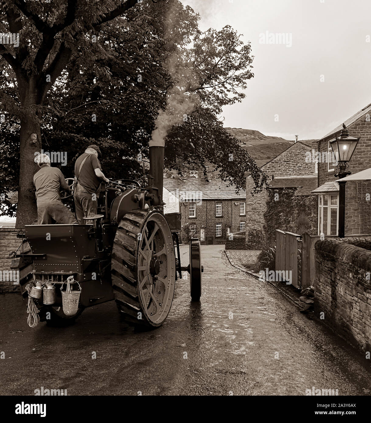 An early 20th Century traction engine in the tiny village of Chinley ...
