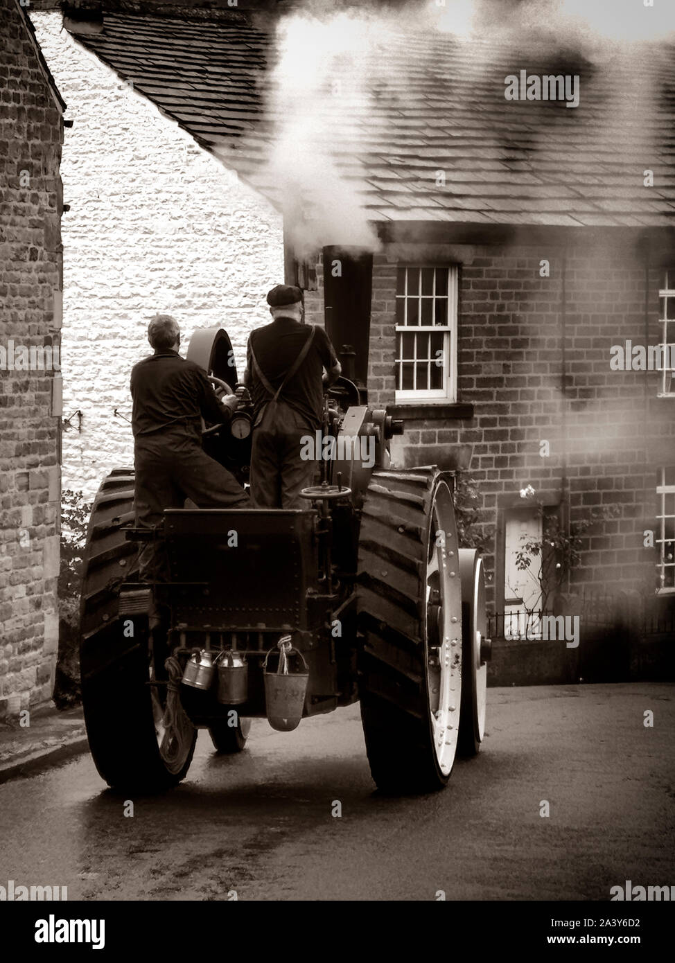 An early 20th Century traction engine in the tiny village of Chinley ...