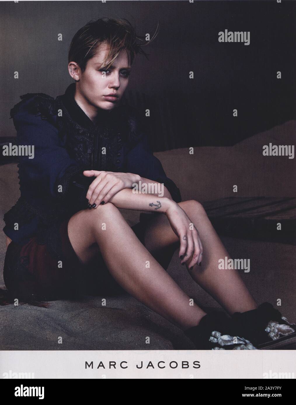 poster advertising Marc Jacobs fashion house with Miley Cyrus in paper ...