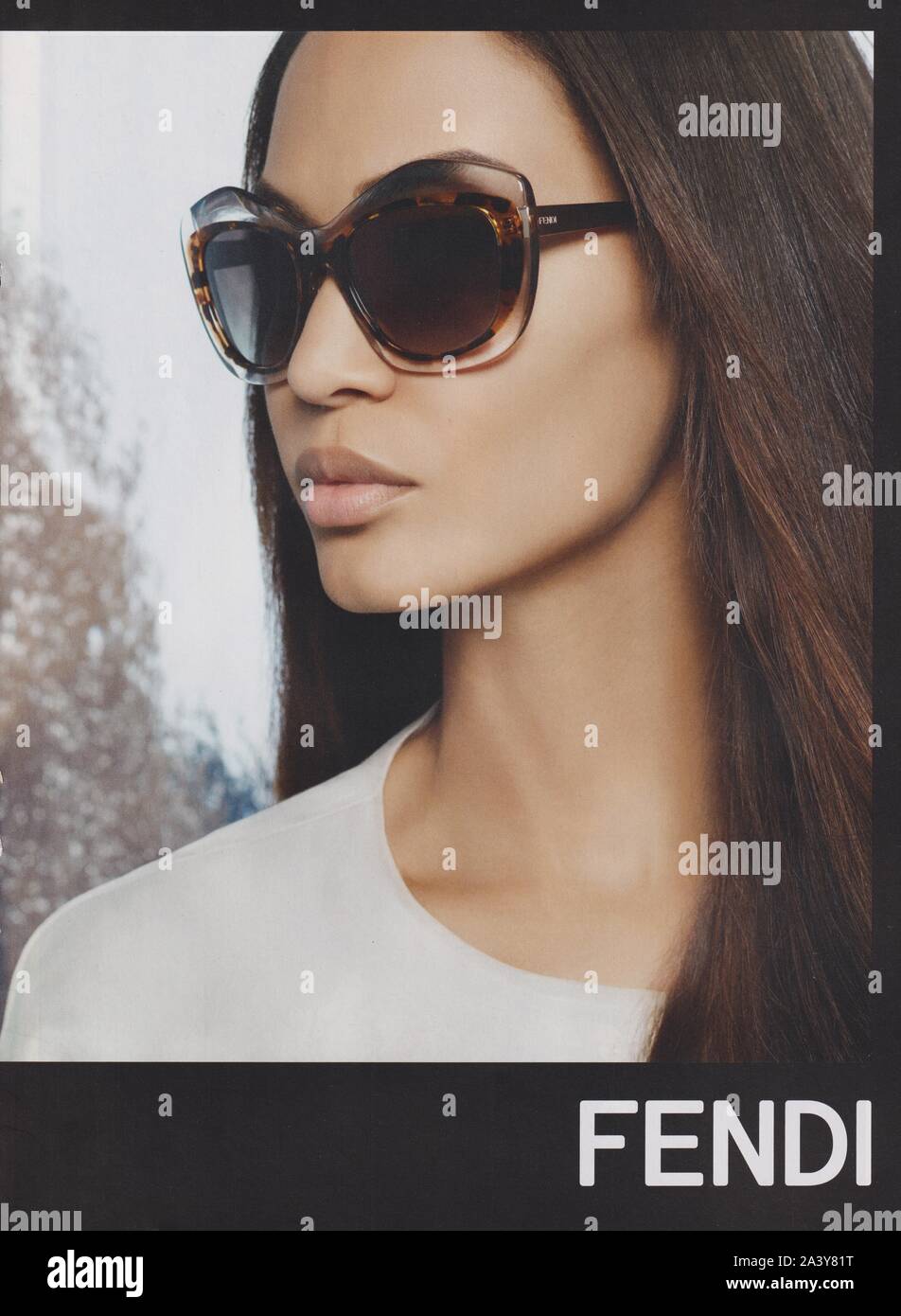 poster advertising FENDI fashion house with Joan Smalls in paper ...