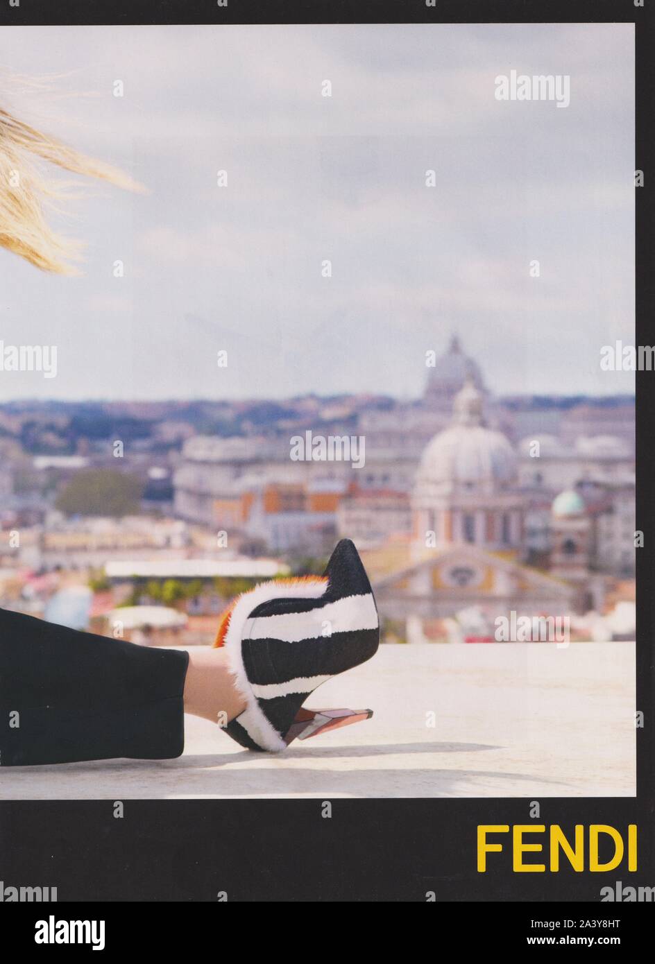 poster advertising FENDI fashion house with Cara Delevingne in paper ...