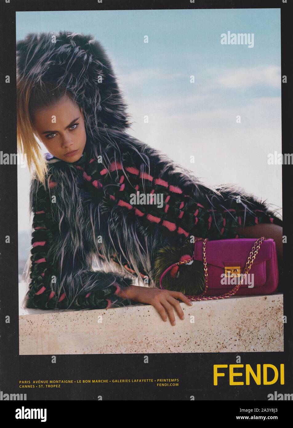 poster advertising FENDI fashion house with Cara Delevingne in paper ...