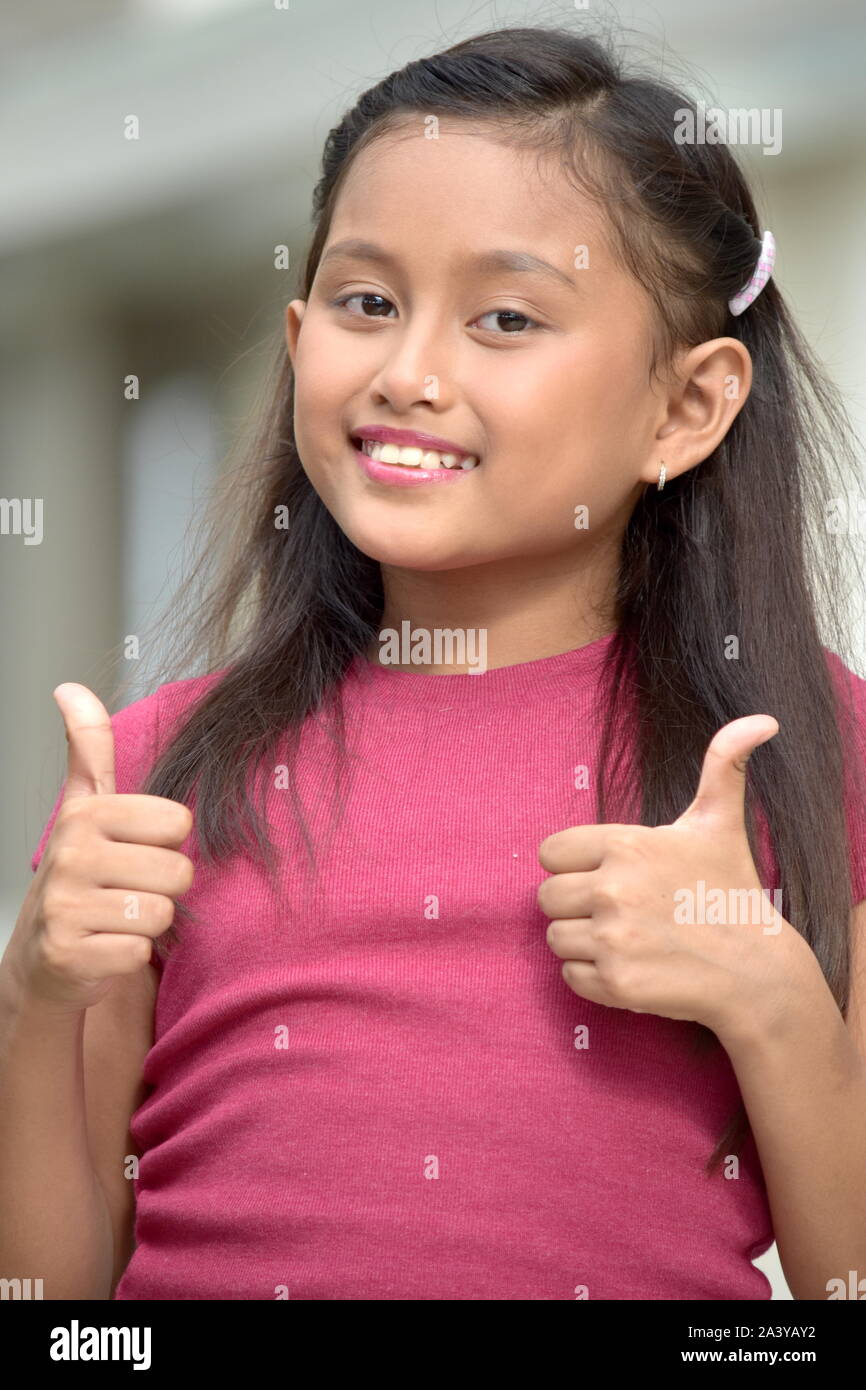 Tween With Thumbs Up Stock Photo - Alamy