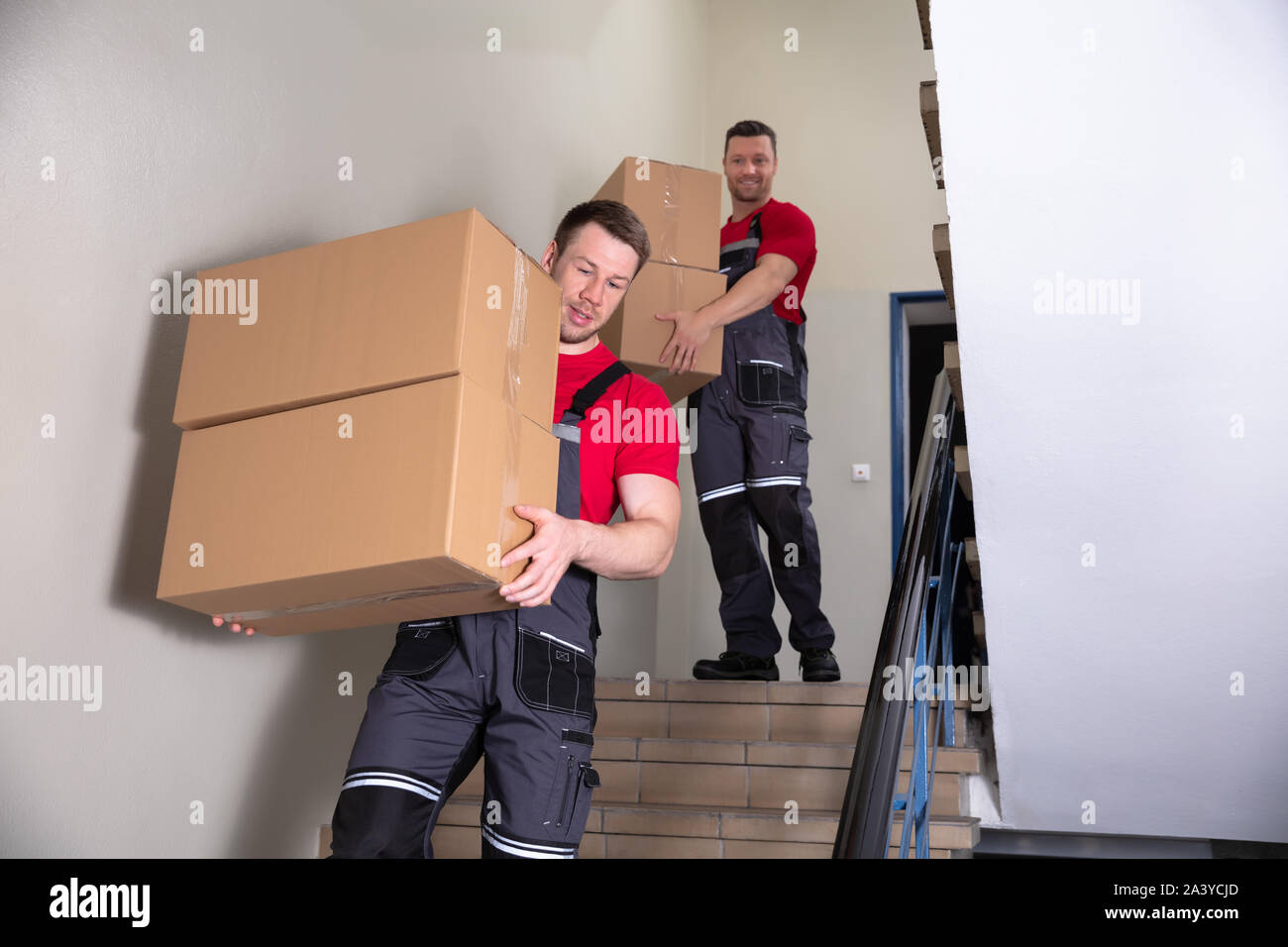Man carrying boxes stairs hi-res stock photography and images - Alamy
