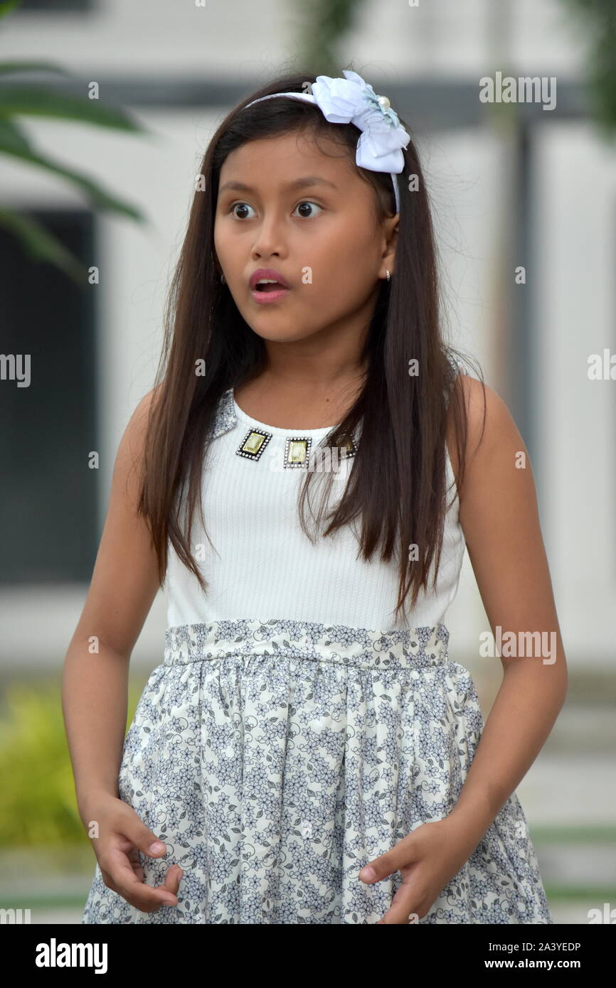Startled Pretty Filipina Tween Stock Photo - Alamy