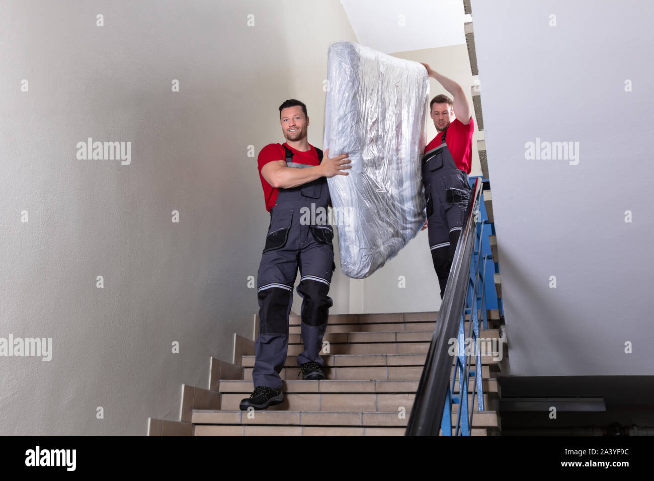 Man carrying mattress hi-res stock photography and images - Alamy