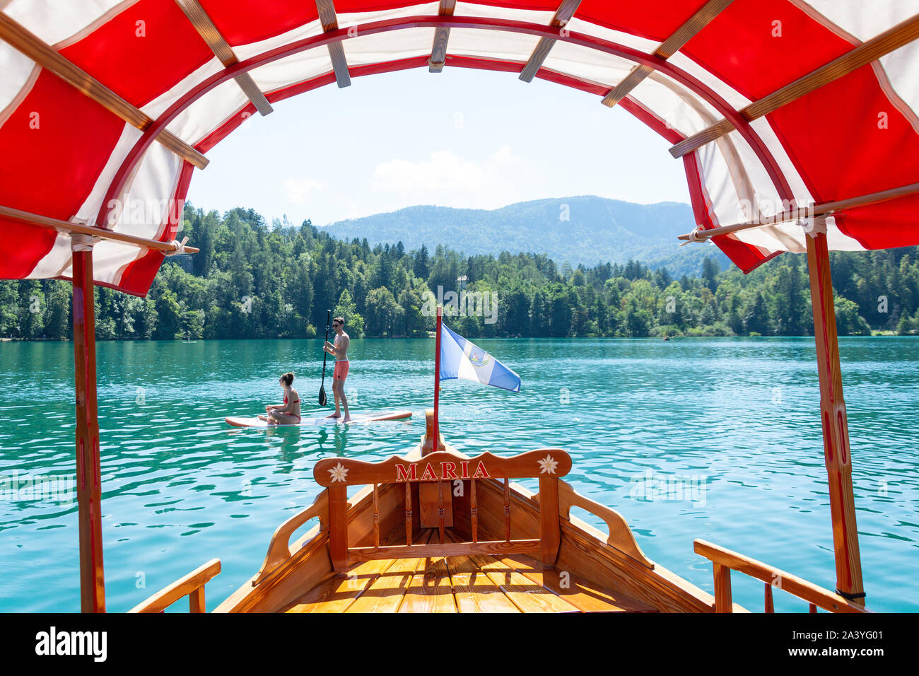 Traditional wooden Pletna boat docked on Bled Island, Lake Bled, Bled ...