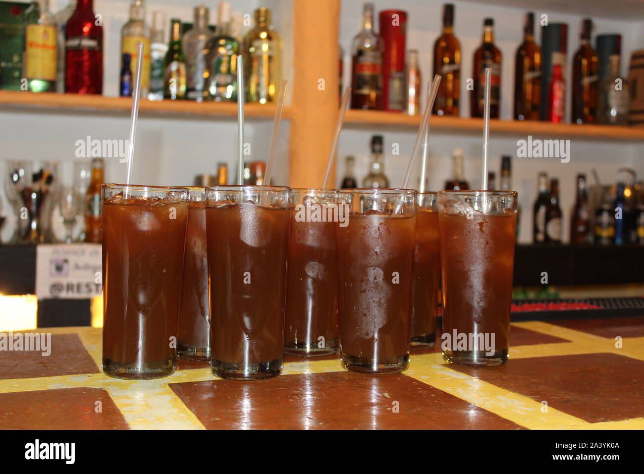 Glasses with cold drinks on a bar counter Stock Photo - Alamy
