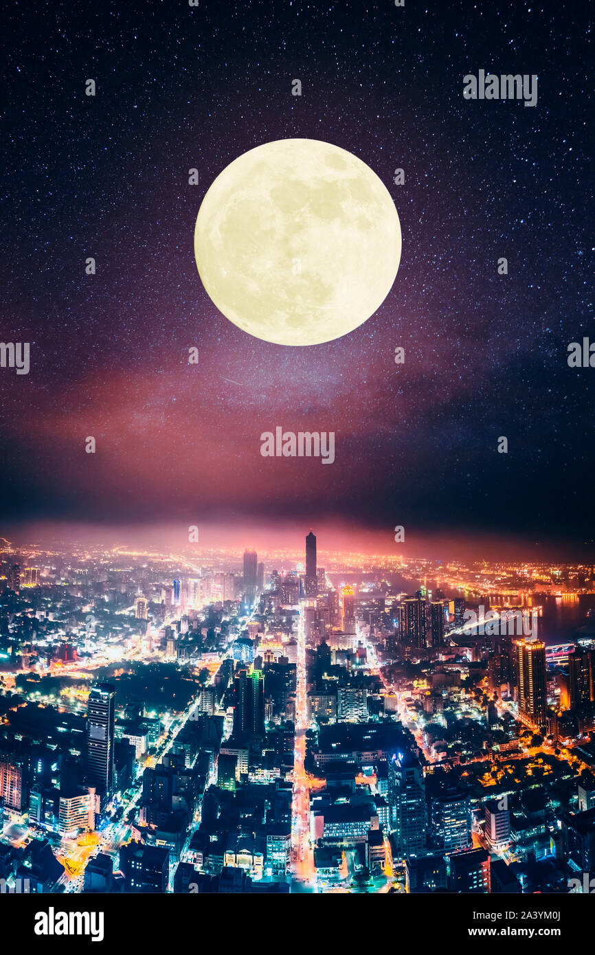 aerial view of city at nigy with full moon Stock Photo - Alamy