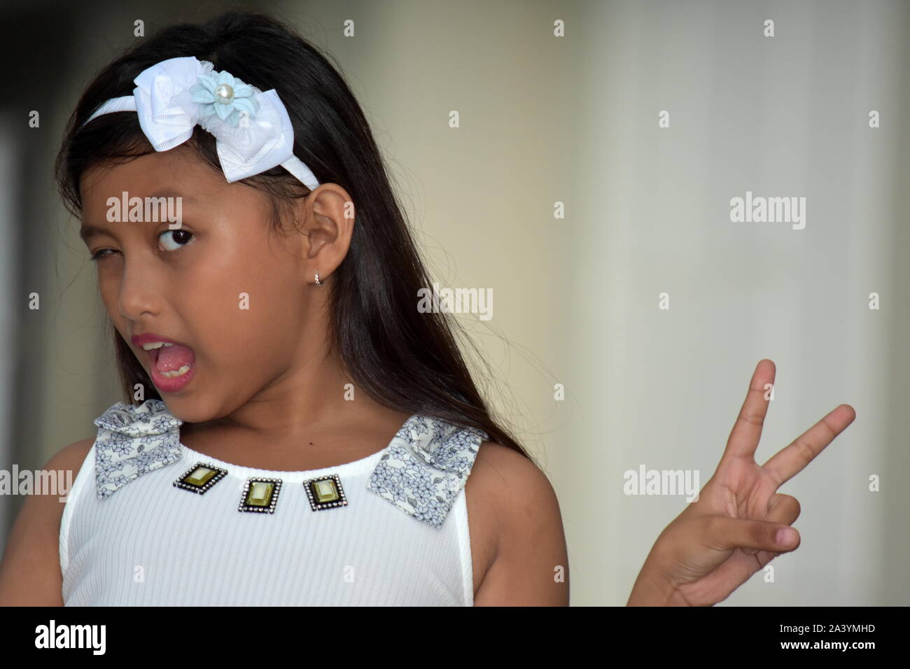 Juvenile And Peace Sign Stock Photo - Alamy