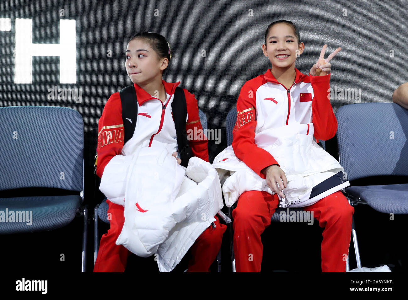 Stuttgart, Germany. 10th Oct, 2019. Tang Xijing (R) of China celebrates ...