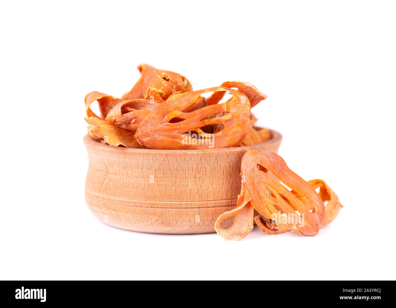 Mace in a wooden bowl, isolated on white background. Nutmeg flower ...