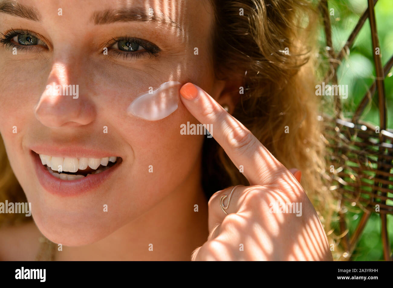 Applying sun cream hi-res stock photography and images - Alamy