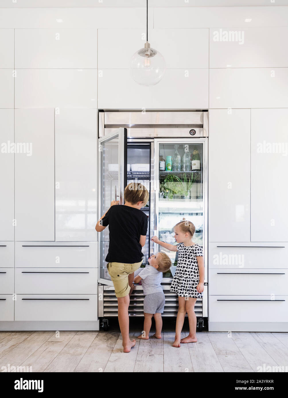 Children opening refrigerator Stock Photo - Alamy