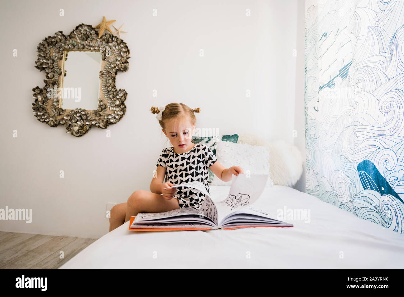 Children reading book on bed hi-res stock photography and images - Alamy