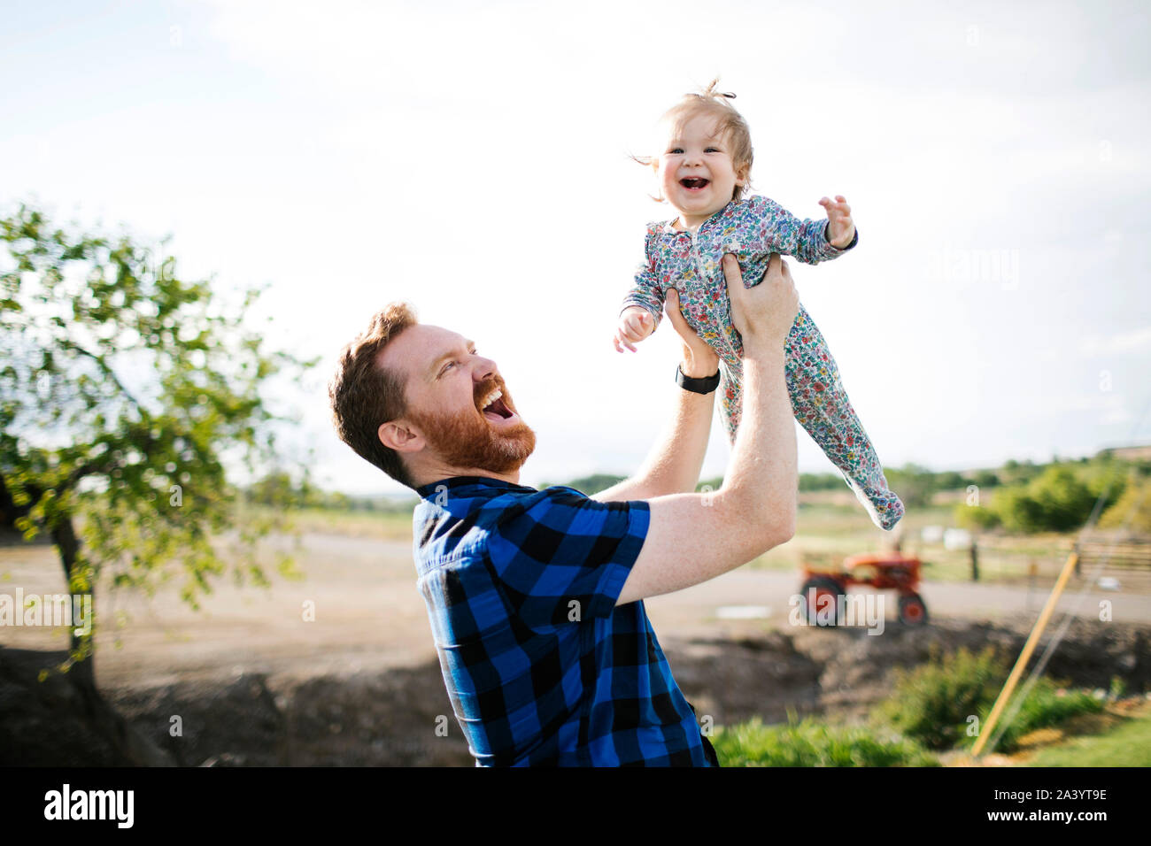 Lifting baby girl hi-res stock photography and images - Alamy