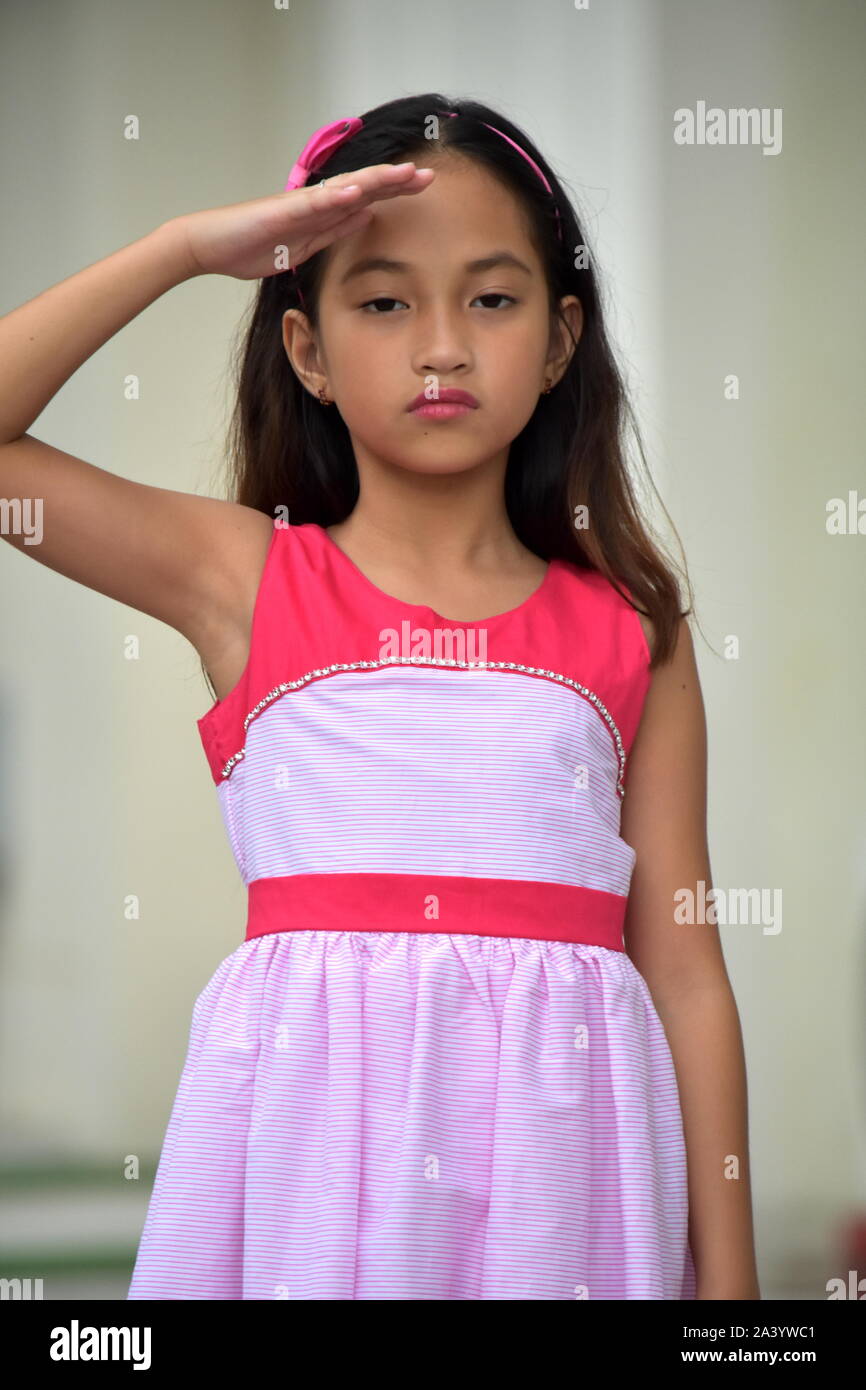 Saluting Youthful Asian Girl Child Stock Photo - Alamy