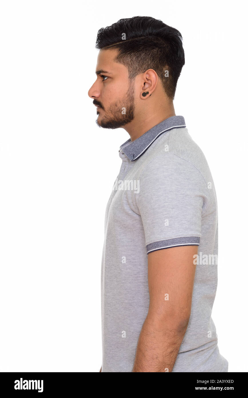 Side view young handsome Indian man isolated against white background ...