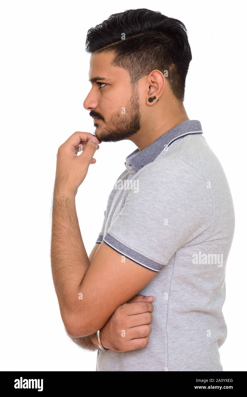Side view young handsome Indian man thinking Stock Photo - Alamy