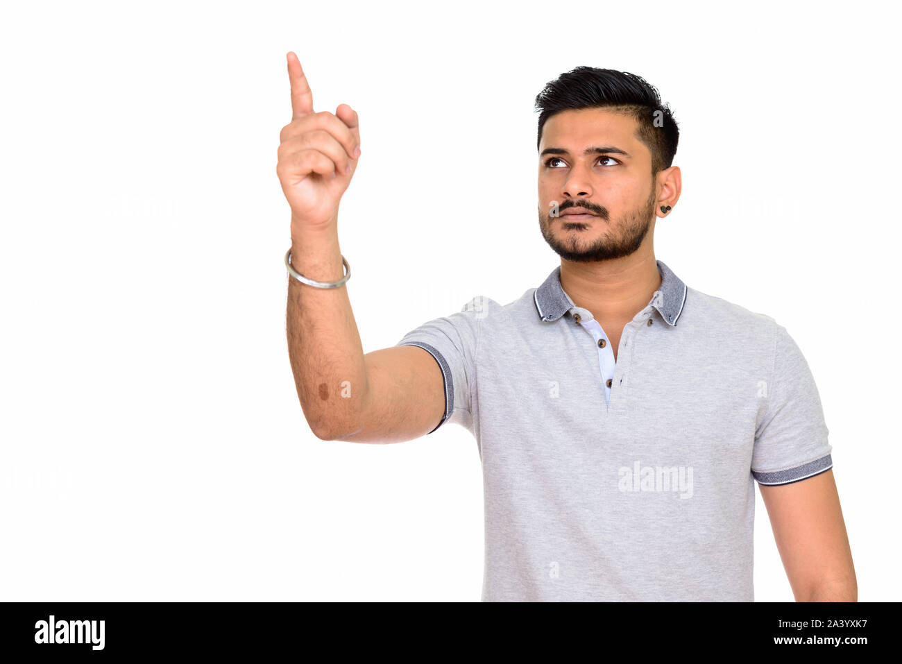 Young handsome Indian man thinking and pointing finger Stock Photo - Alamy