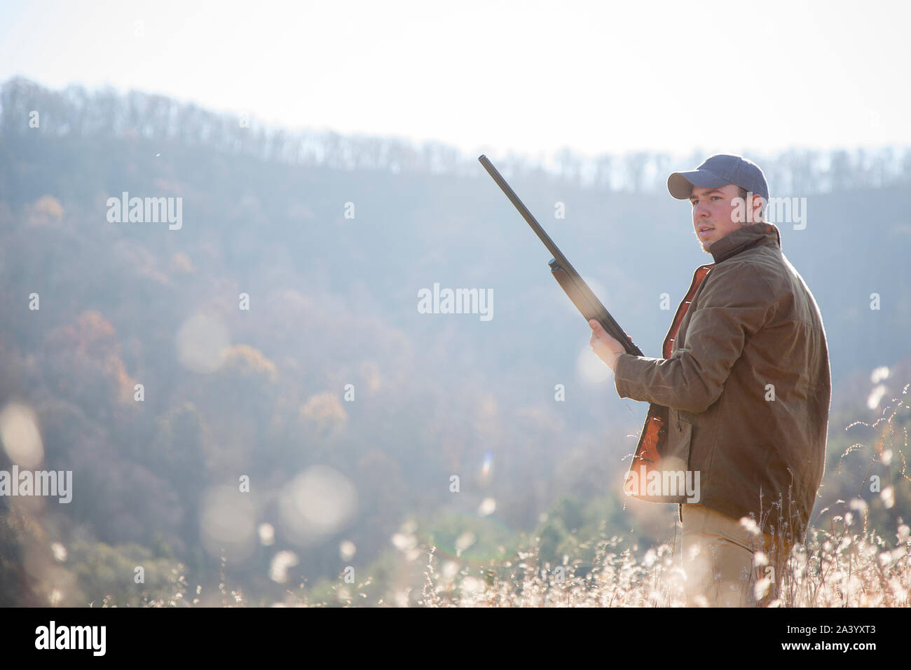 Man holding rifle hi-res stock photography and images - Alamy