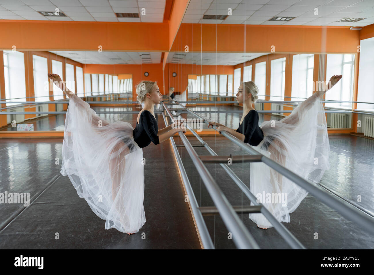 Ballet dancer practicing at barre Stock Photo - Alamy