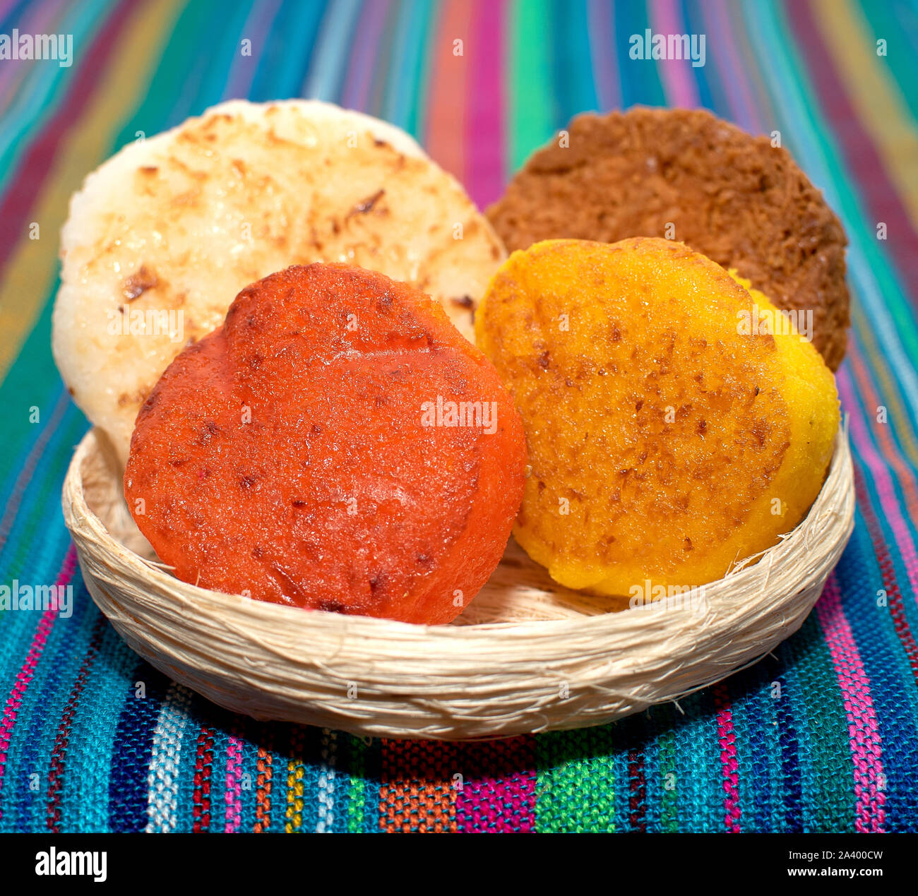 basket with a bunch of typical mexican coconut candies honey cocada ...