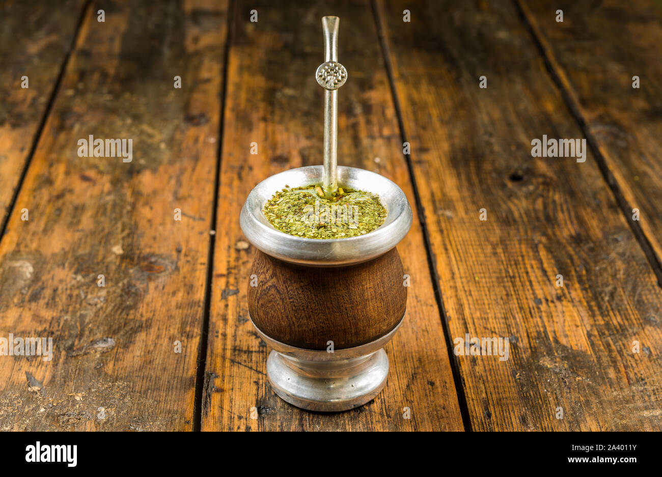 Traditional Argentinian yerba mate tea in a calabash gourd with ...