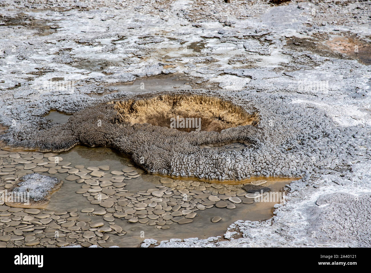 Small geyser before an eruption in the upper geyser basin in ...
