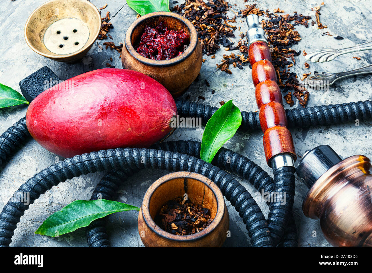 Smoking hookah.Details of shisha.Shisha with mango aroma of tobacco ...
