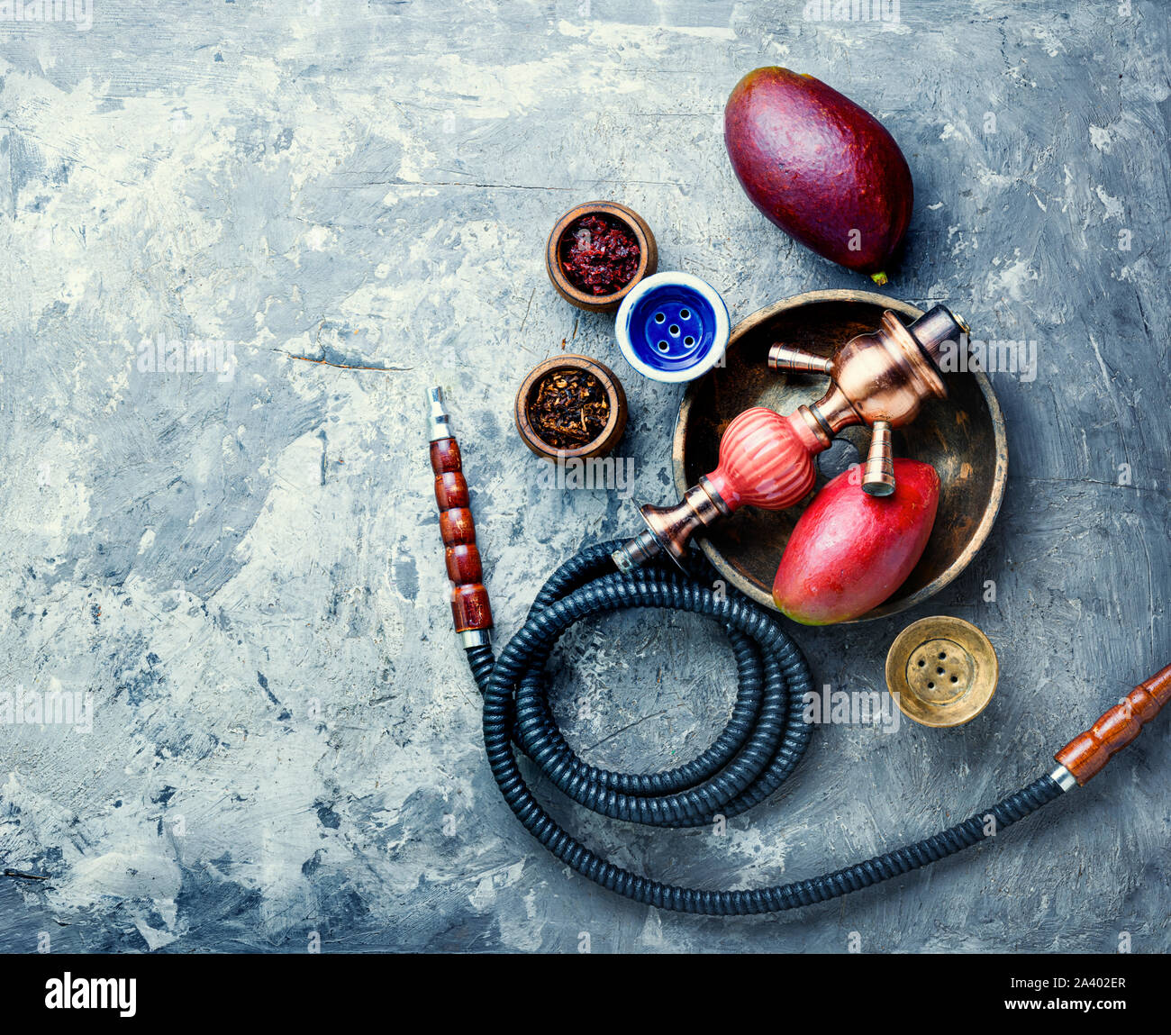 Smoking hookah.Details of shisha.Shisha with mango aroma of tobacco ...
