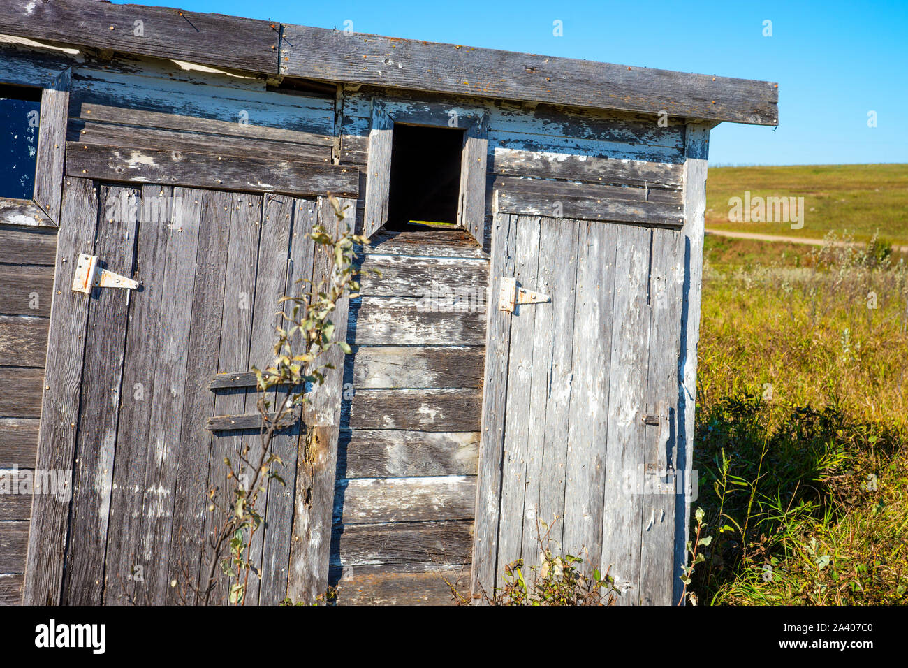 One-room country school outhouse on the North Dakota prairie in late ...
