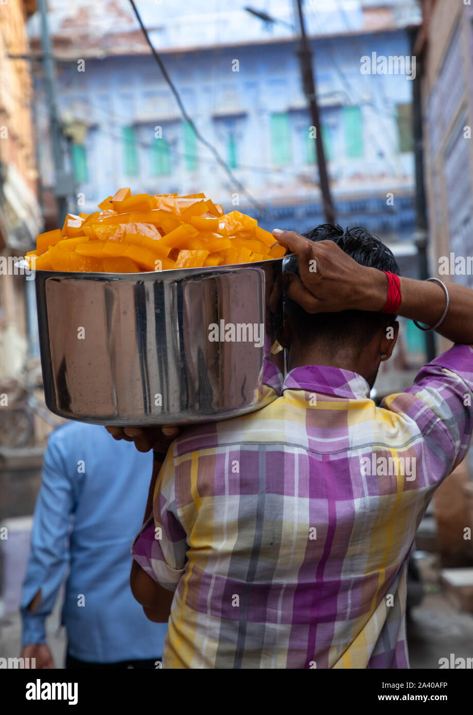 Indian man carrying food in the street, Rajasthan, Jodhpur, India Stock ...