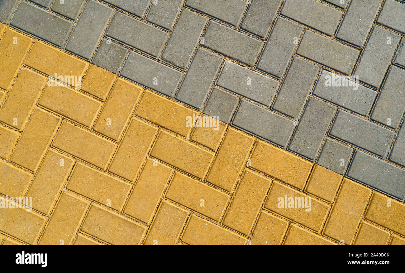 yellow and grey paving tile for background or texture Stock Photo - Alamy