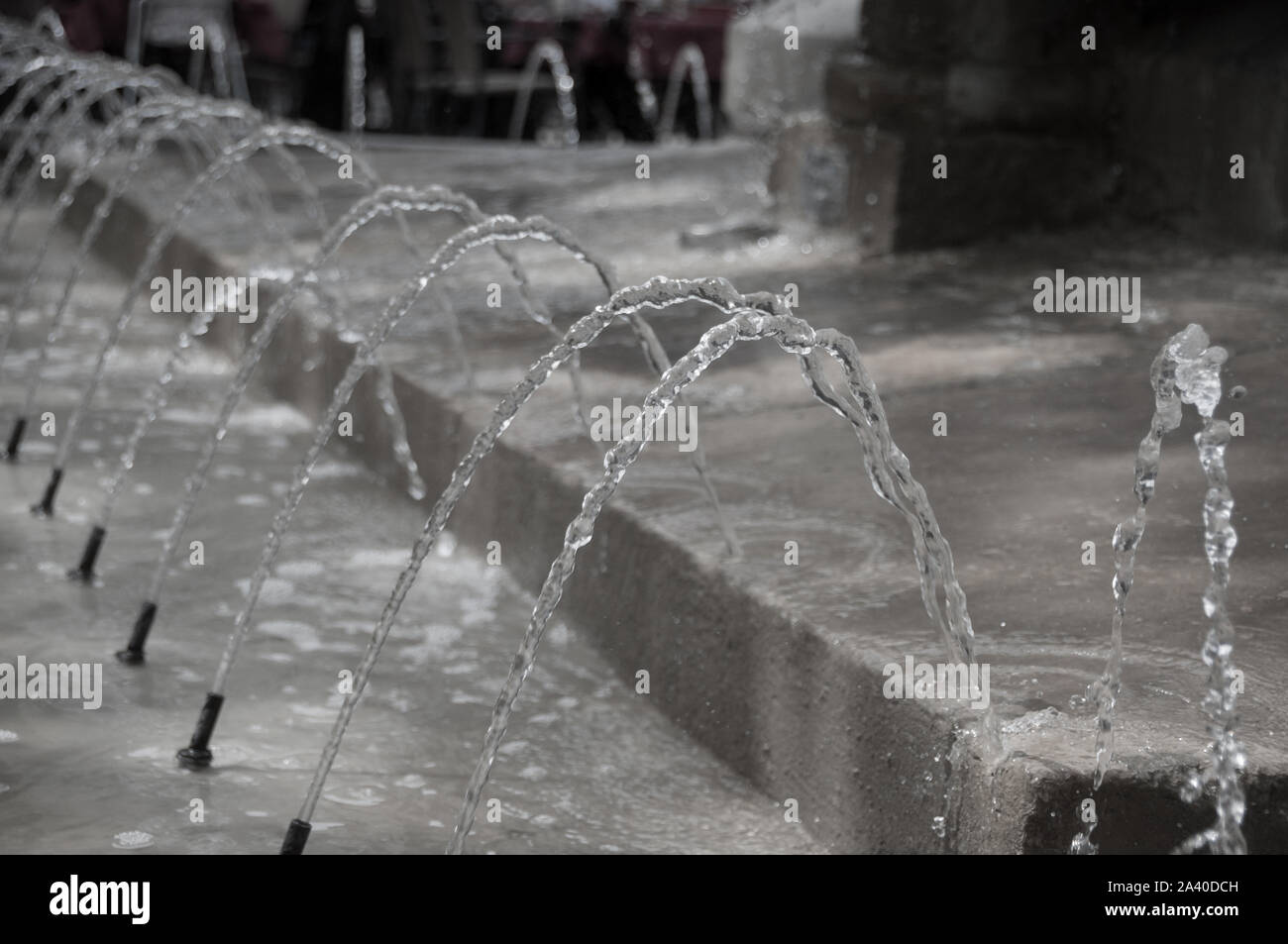 Detail of public fountain with many small water jets Stock Photo - Alamy