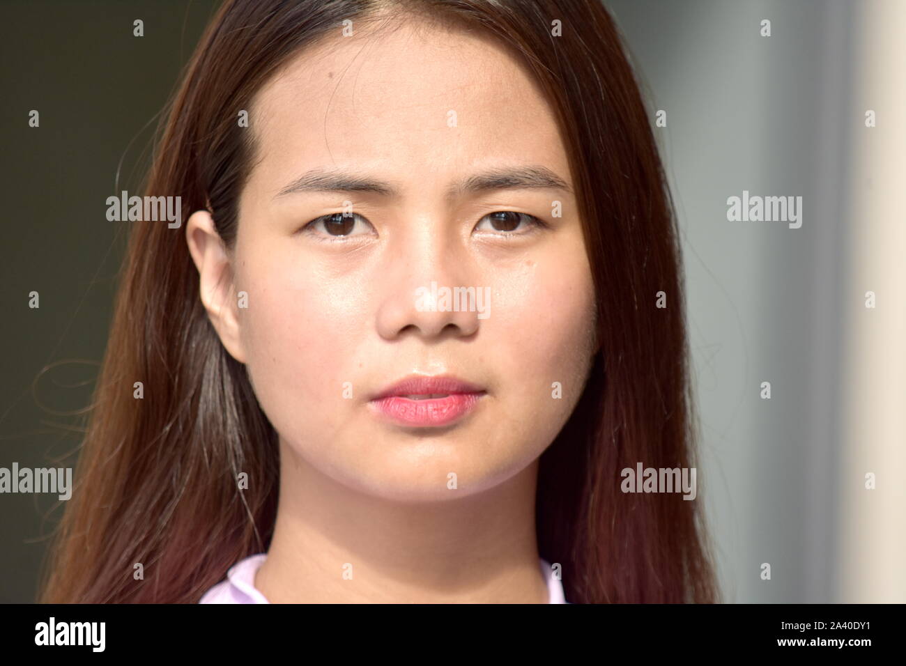 Somber looking young woman hi-res stock photography and images - Alamy