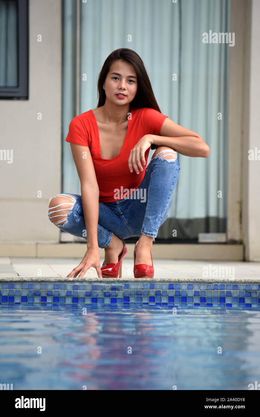 Cute Filipina Female Sitting Stock Photo - Alamy