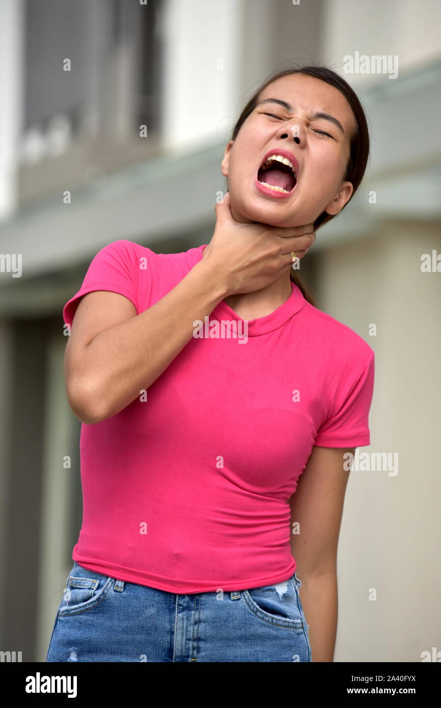 Young Filipina Woman Choking Stock Photo - Alamy